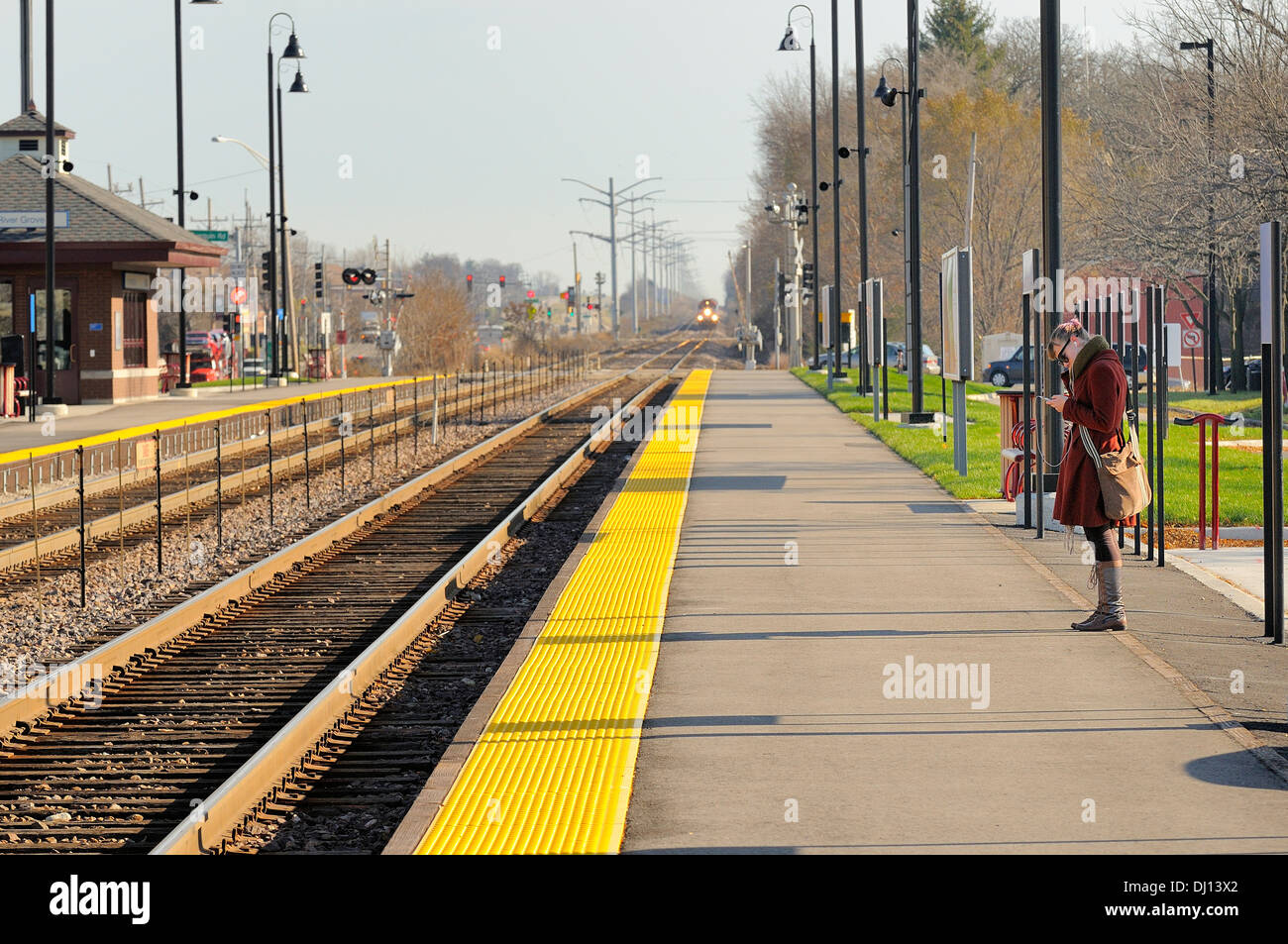 Suburban Train station platform and tracks Stock Photo - Alamy