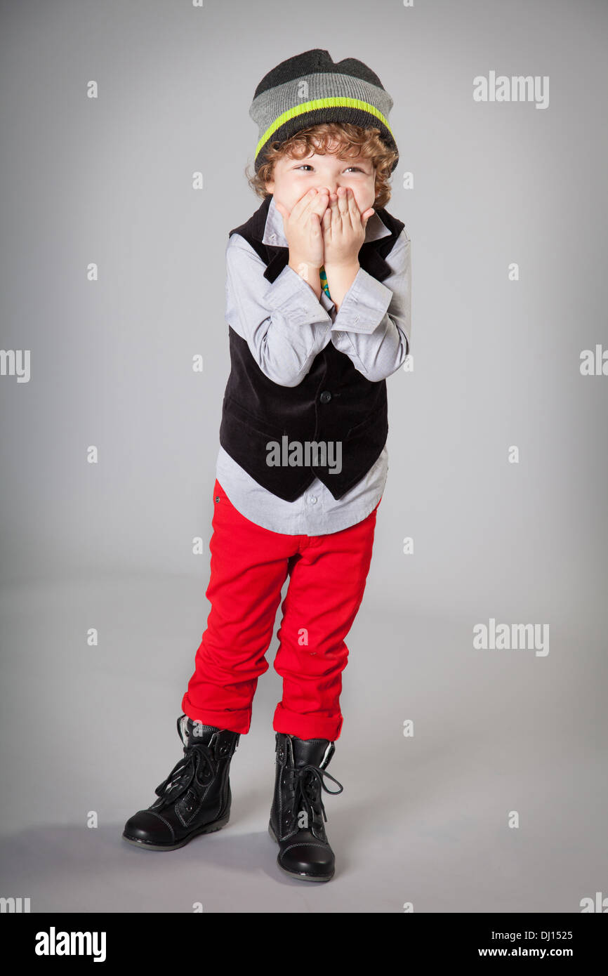 Young boy laughs and giggles while wearing holiday fashions Stock Photo ...