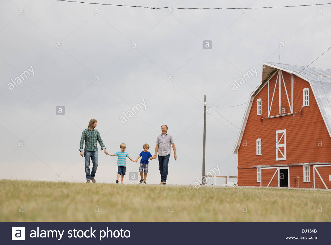 Three generation family holding hands hi-res stock photography and ...
