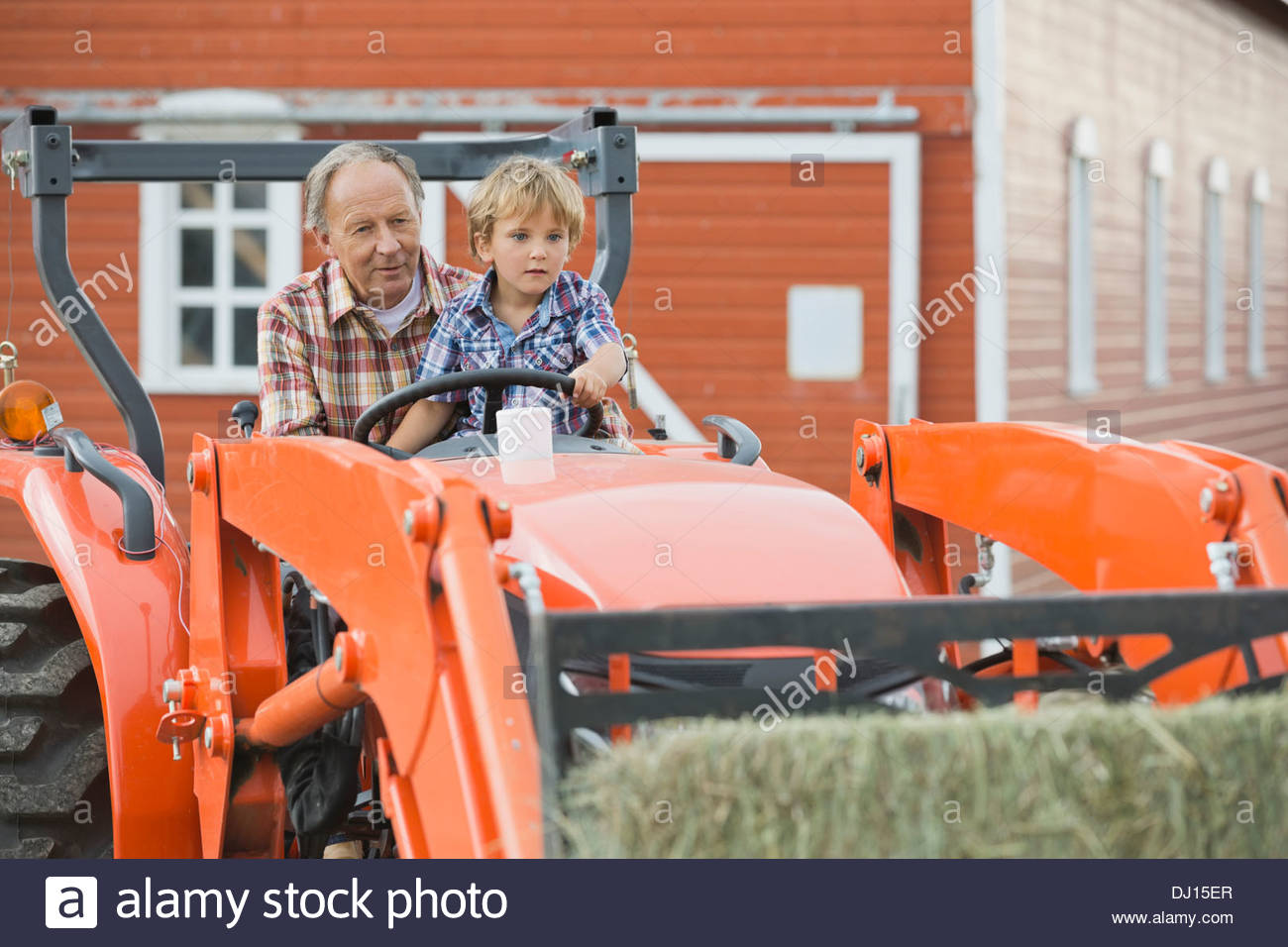 Boy driving tractor hi-res stock photography and images - Alamy