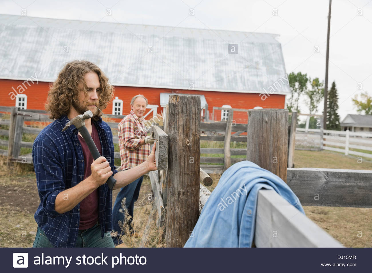 Man building fence man building fence hi-res stock photography and ...