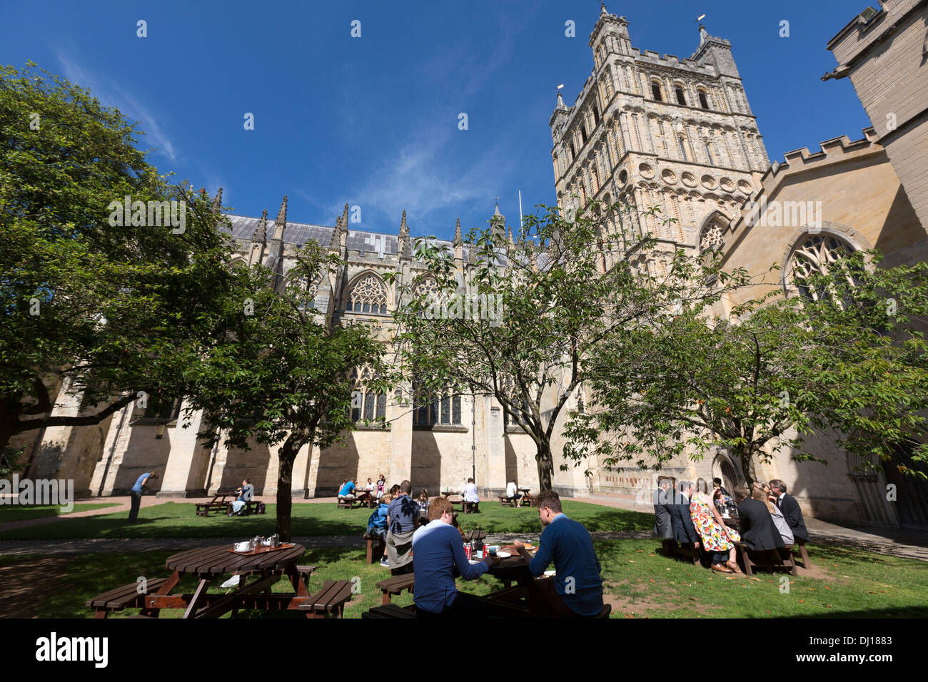 People having lunch outside of Exeter Cathedral Stock Photo - Alamy