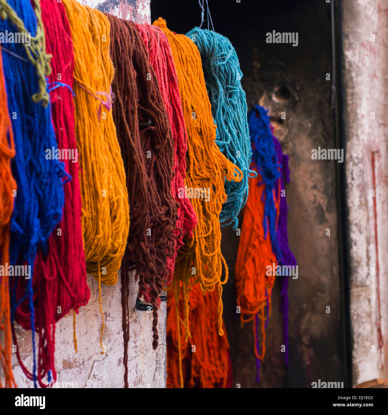 Bundles Of Various Colours Of Yarn Hanging Against A Wall Stock Photo ...