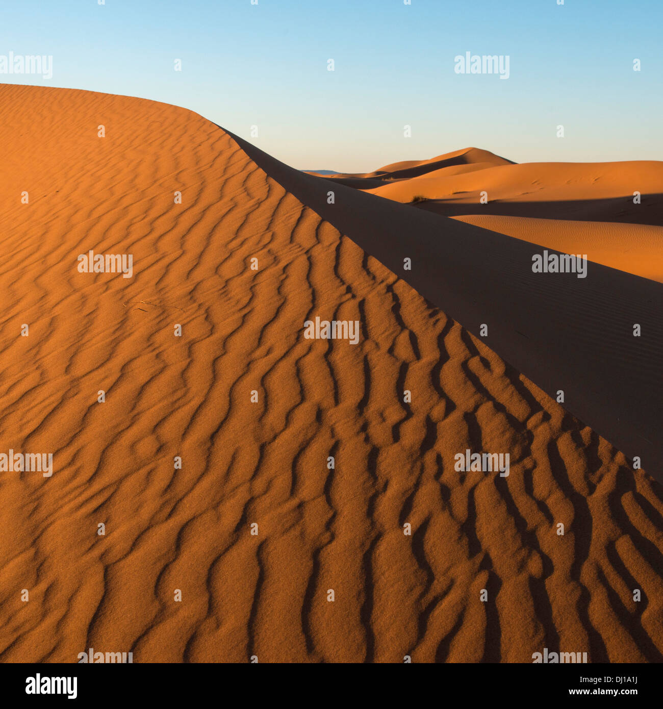 Sand Slopes And Ridges With A Blue Sky Stock Photo - Alamy