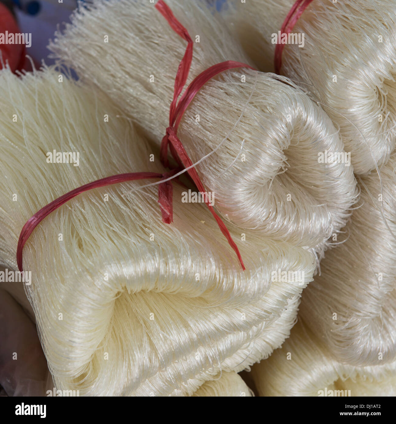 Strands Of A White Fibre Tied With Red String In Bundles Stock Photo ...
