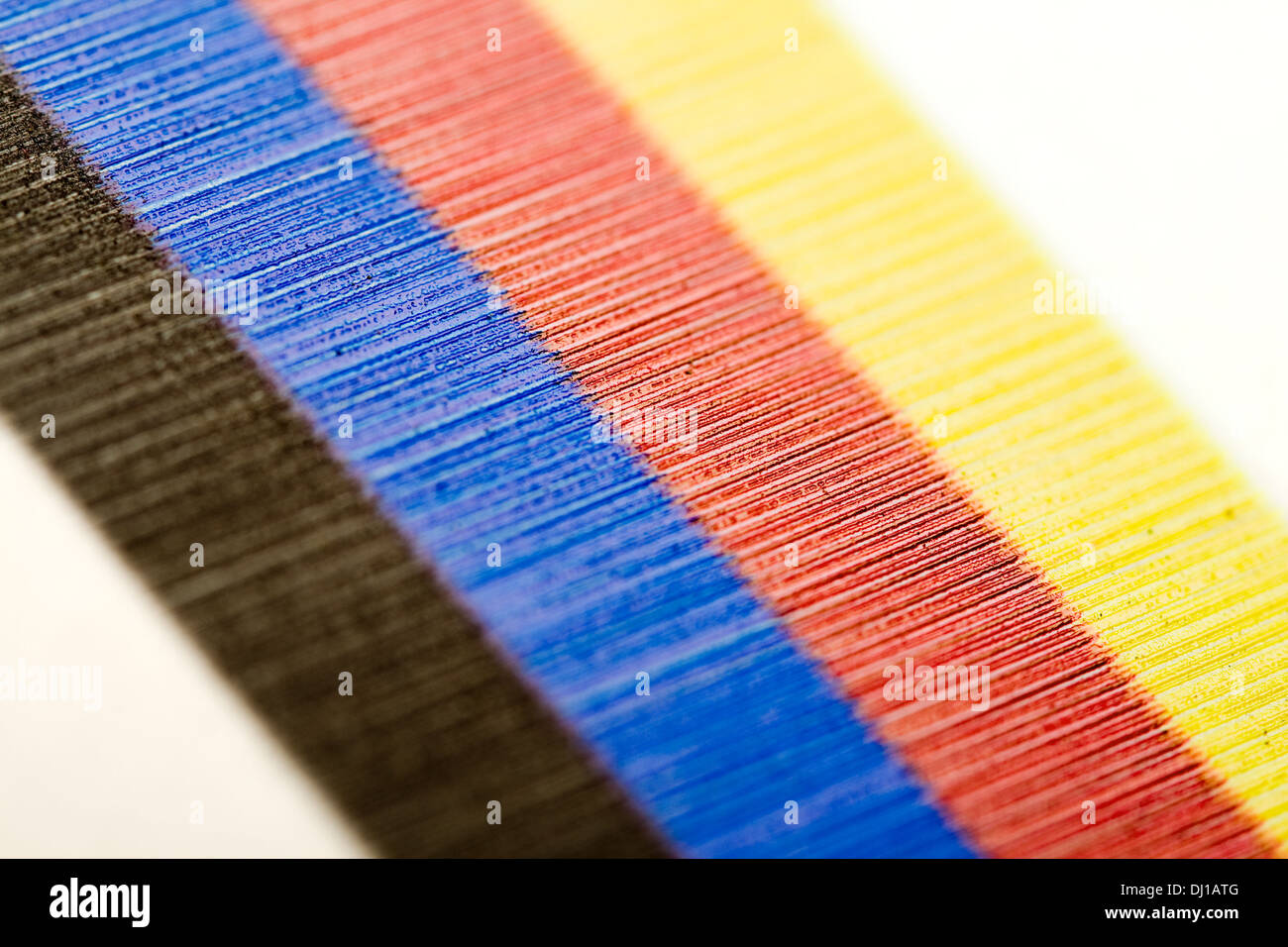 Extreme macro of a digital UV print, CMYK strips on the side of the ...