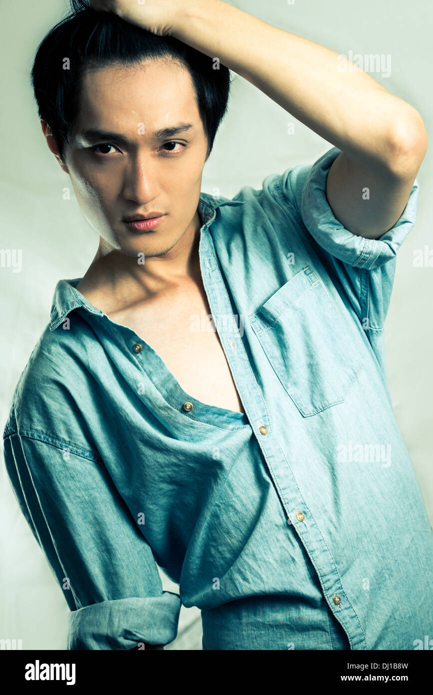 Studio fashion pose by a handsome young male model, with fashion tone ...