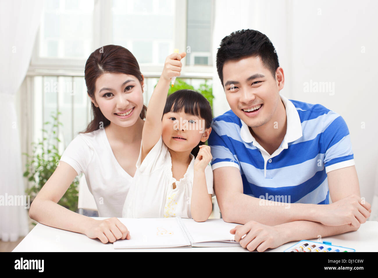 Family writing graffiti Stock Photo - Alamy
