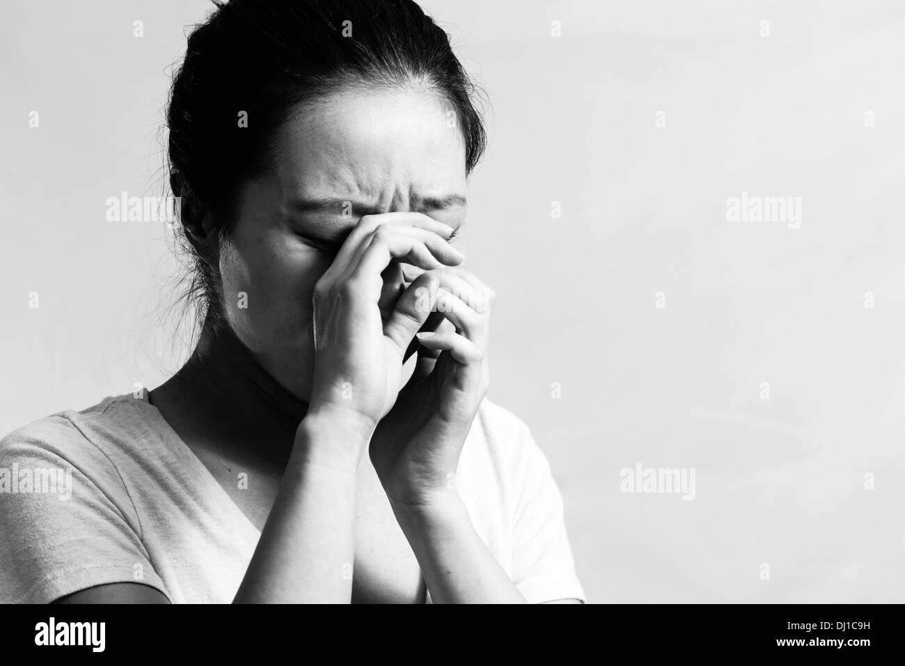Portrait of pretty girl crying desperately, black and white style Stock ...