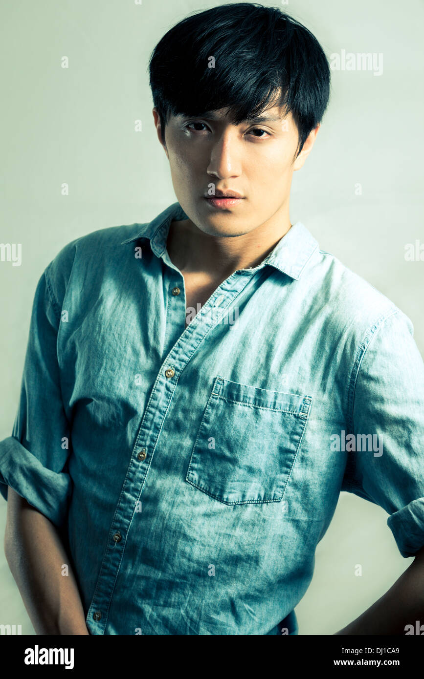 Studio fashion pose by a handsome young male model, with fashion tone ...