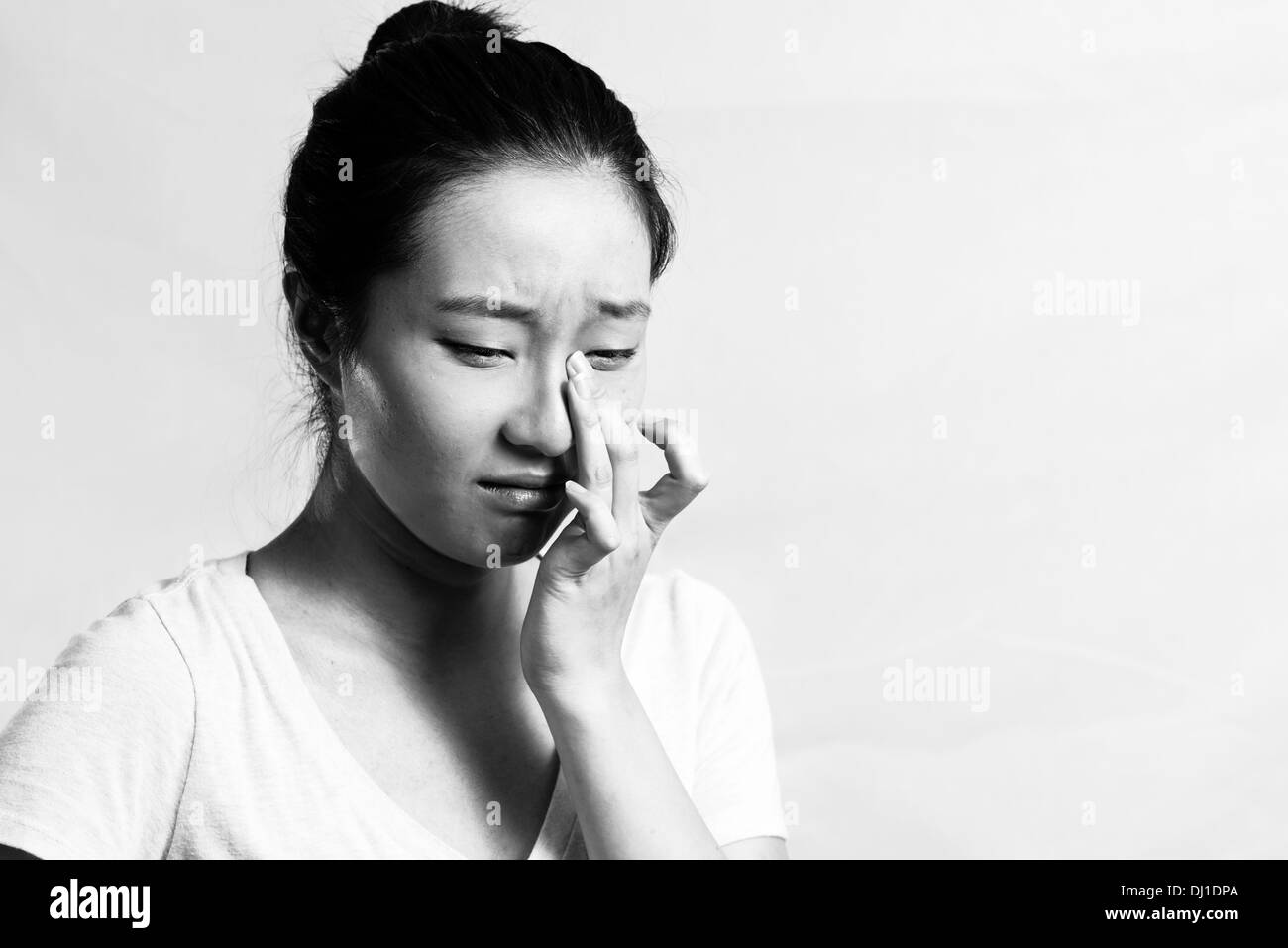 Portrait of pretty girl crying desperately, black and white style Stock ...
