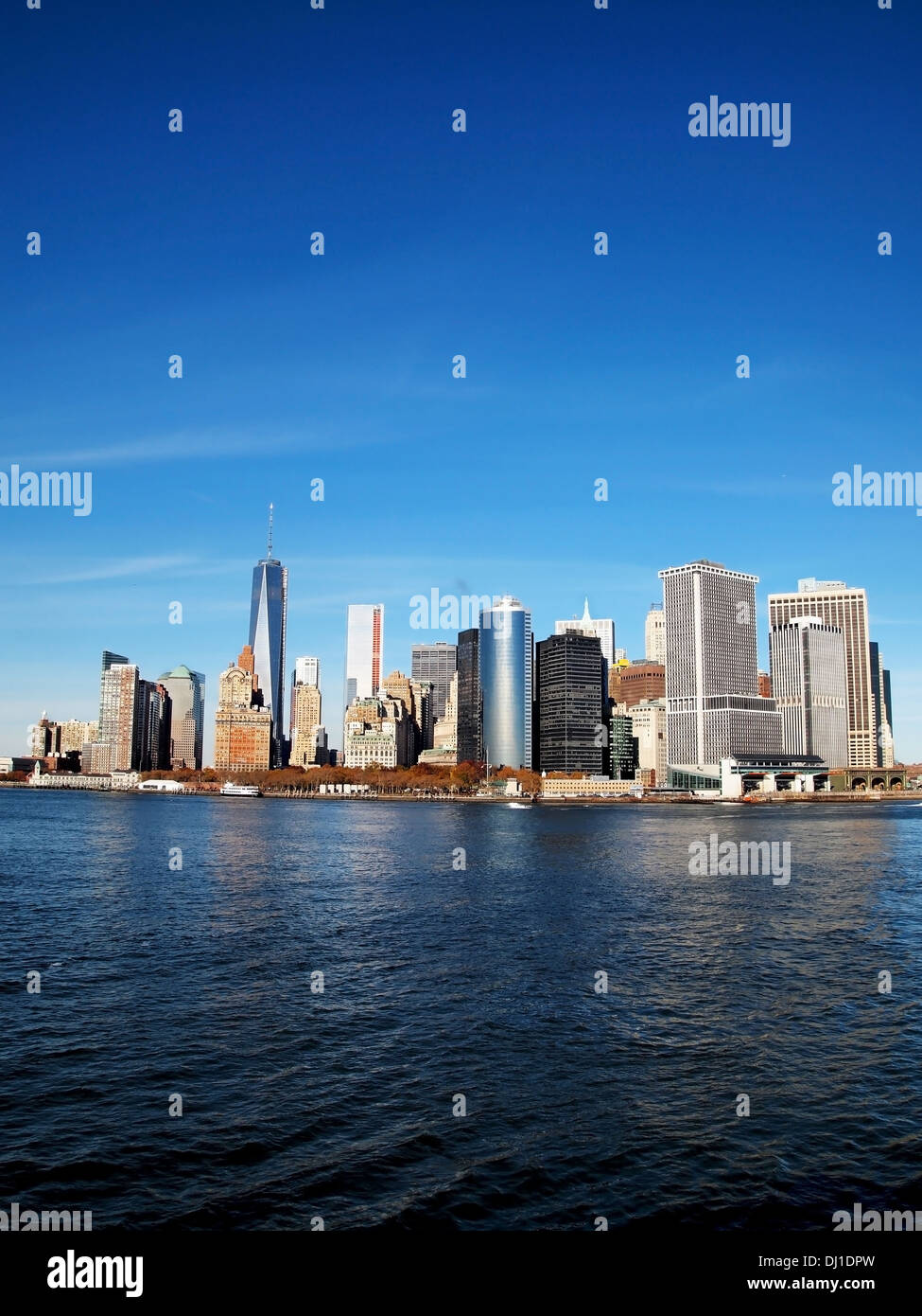 A vertical composition of the lower Manhattan skyline, viewed from ...
