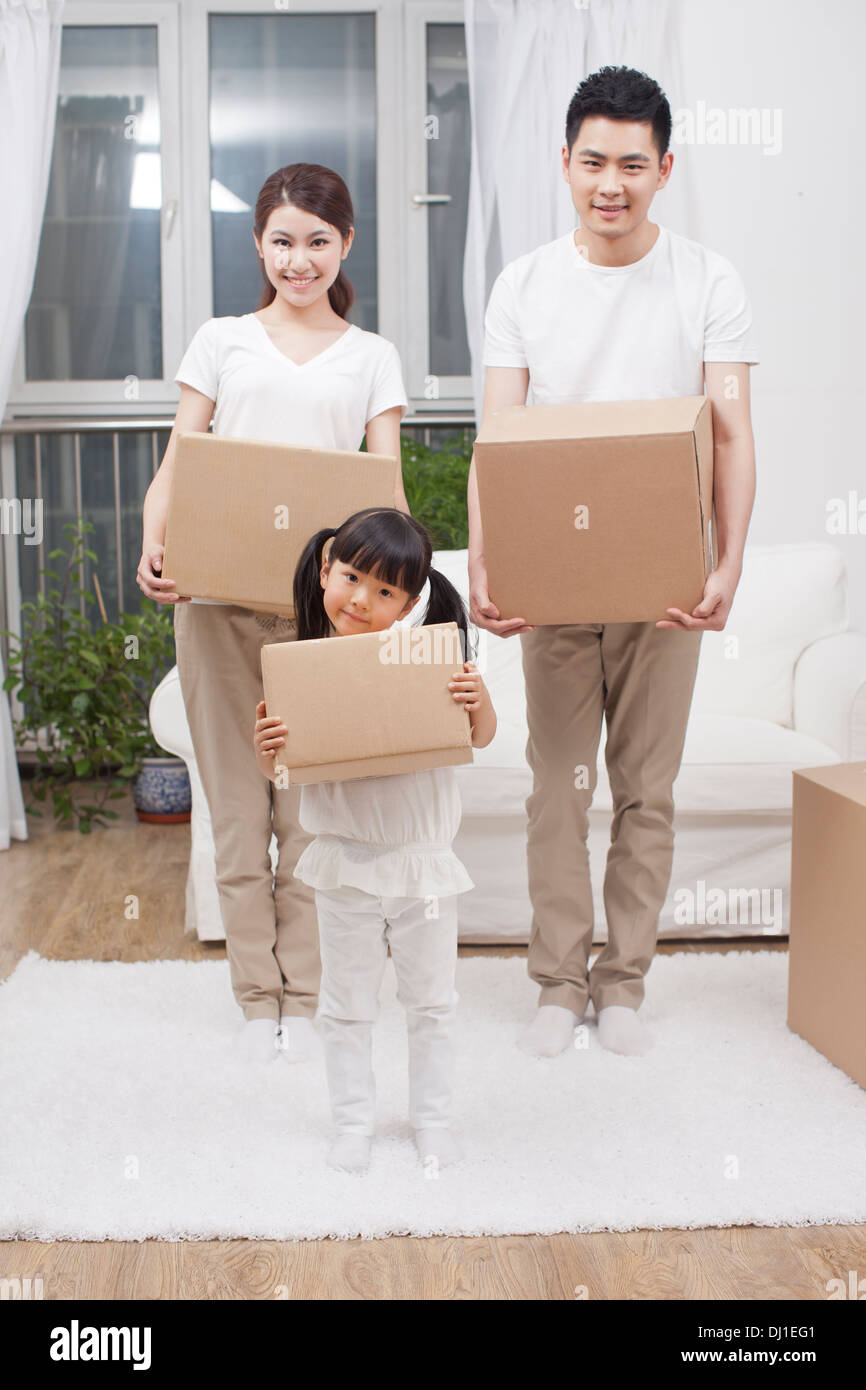 Family moving to a new house Stock Photo - Alamy
