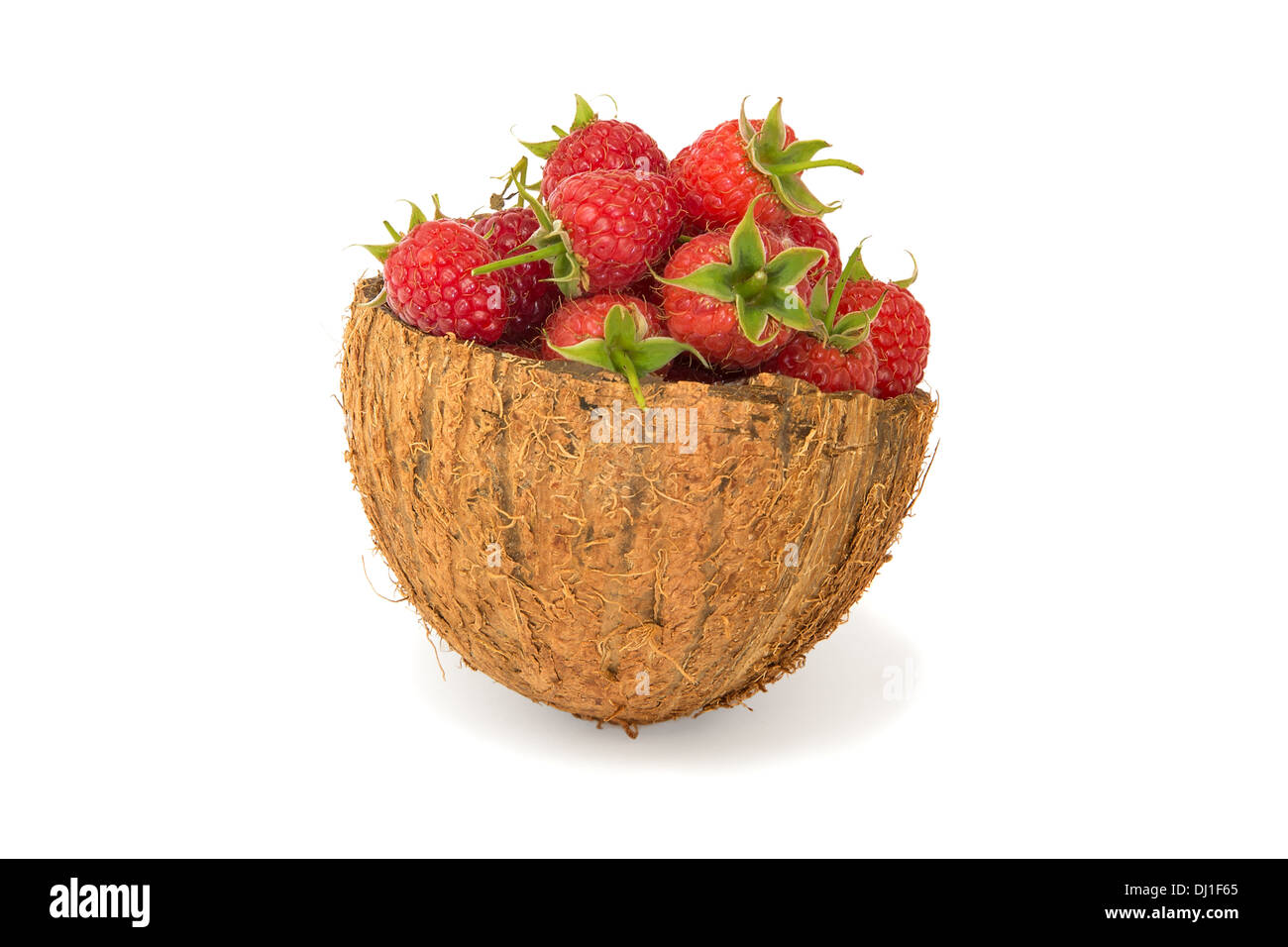 Raspberries in a coconut shell isolated on white background Stock Photo ...