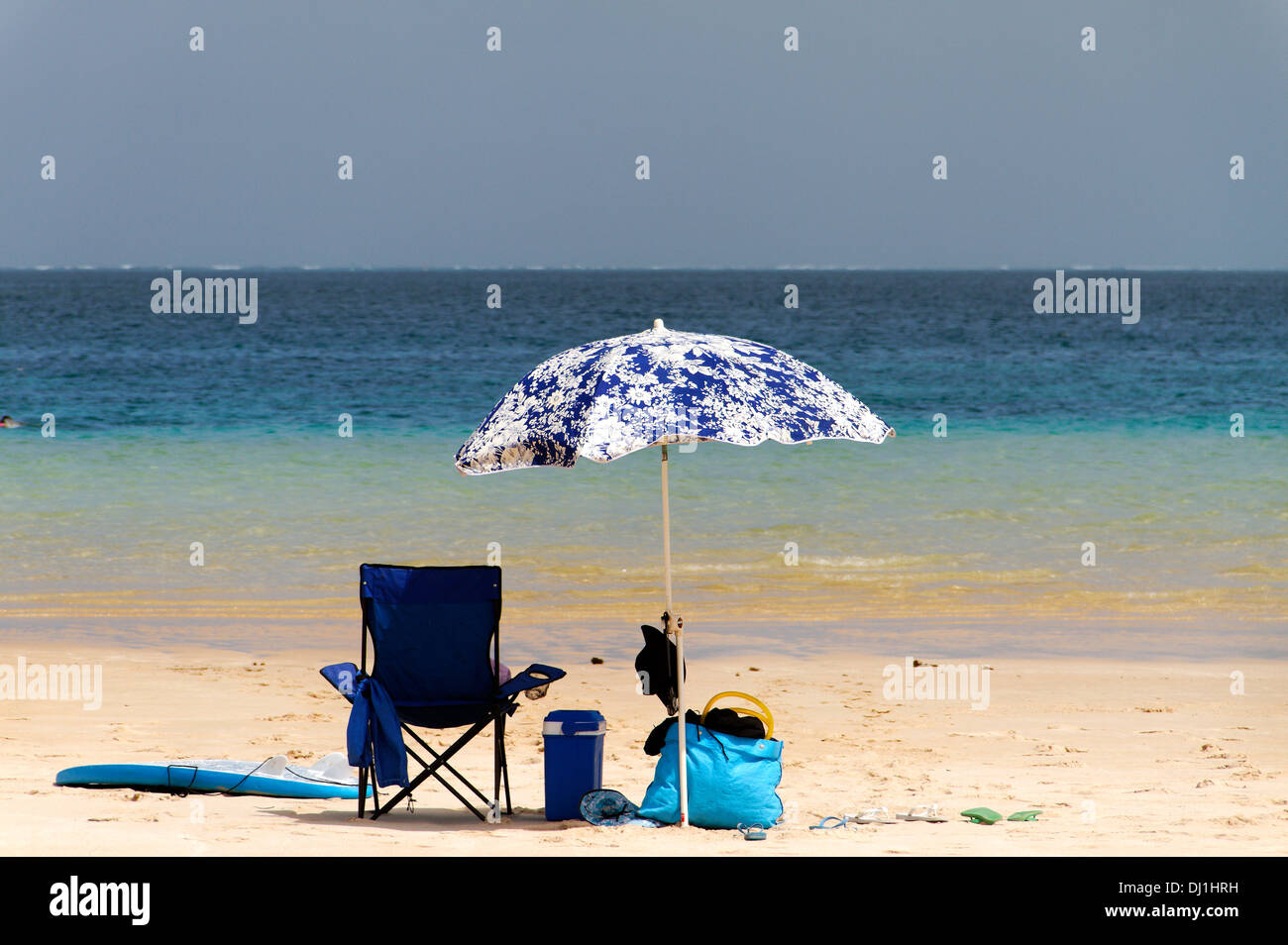 Beach umbrella and deck chair on sandy beach, Coral Bay Western ...