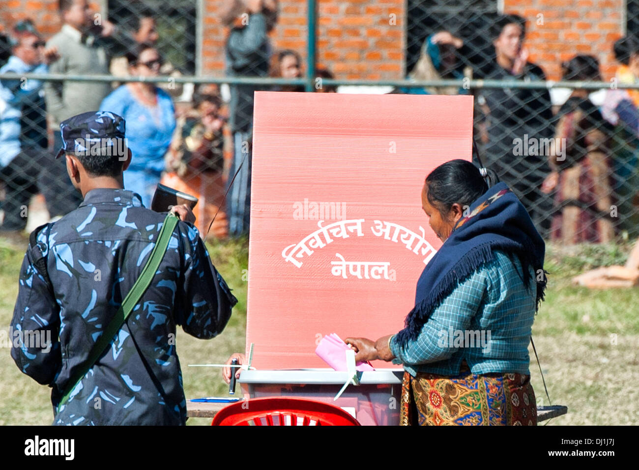 Kathmandu, Kathmandu, Nepal. 19th Nov, 2013. A women places ballot ...