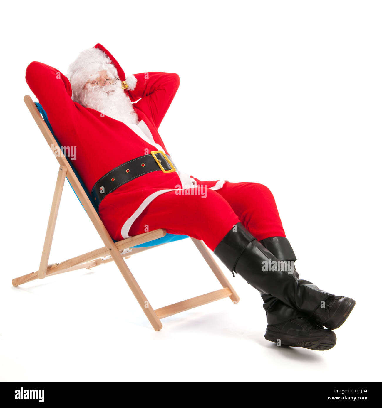 Santa Claus in beach chair on vacation isolated over white background ...