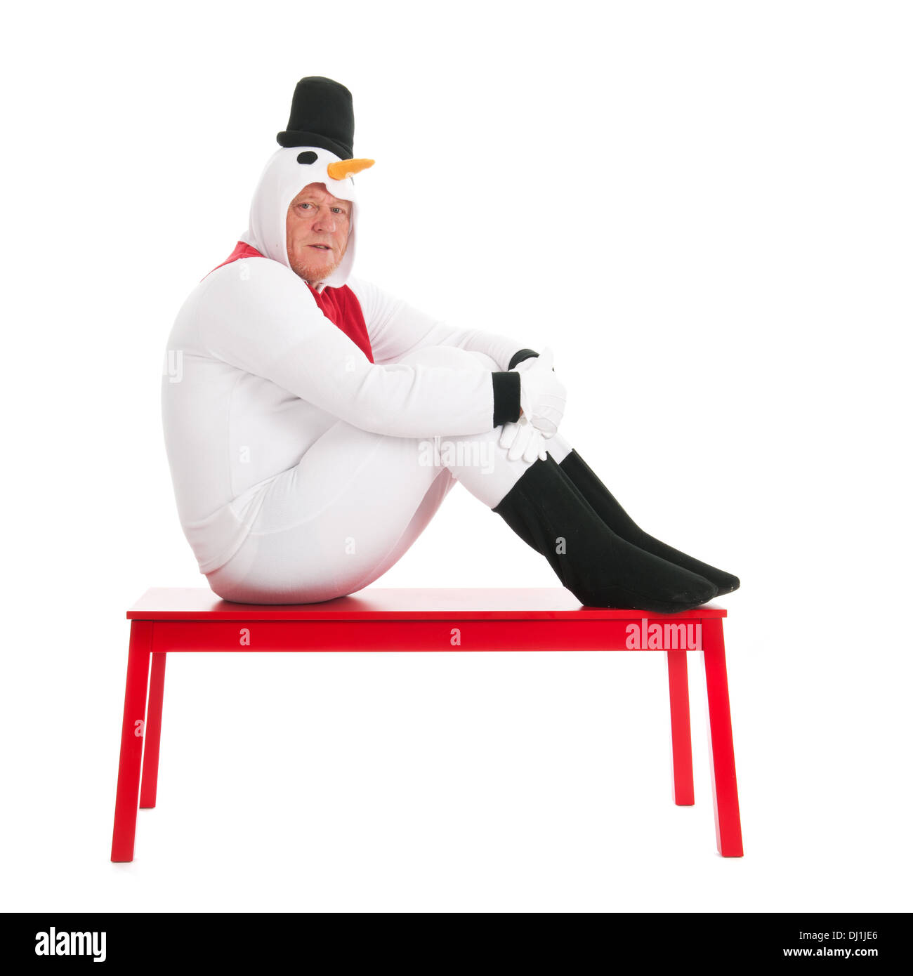 Human snowman sitting on red bench isolated over white background Stock ...
