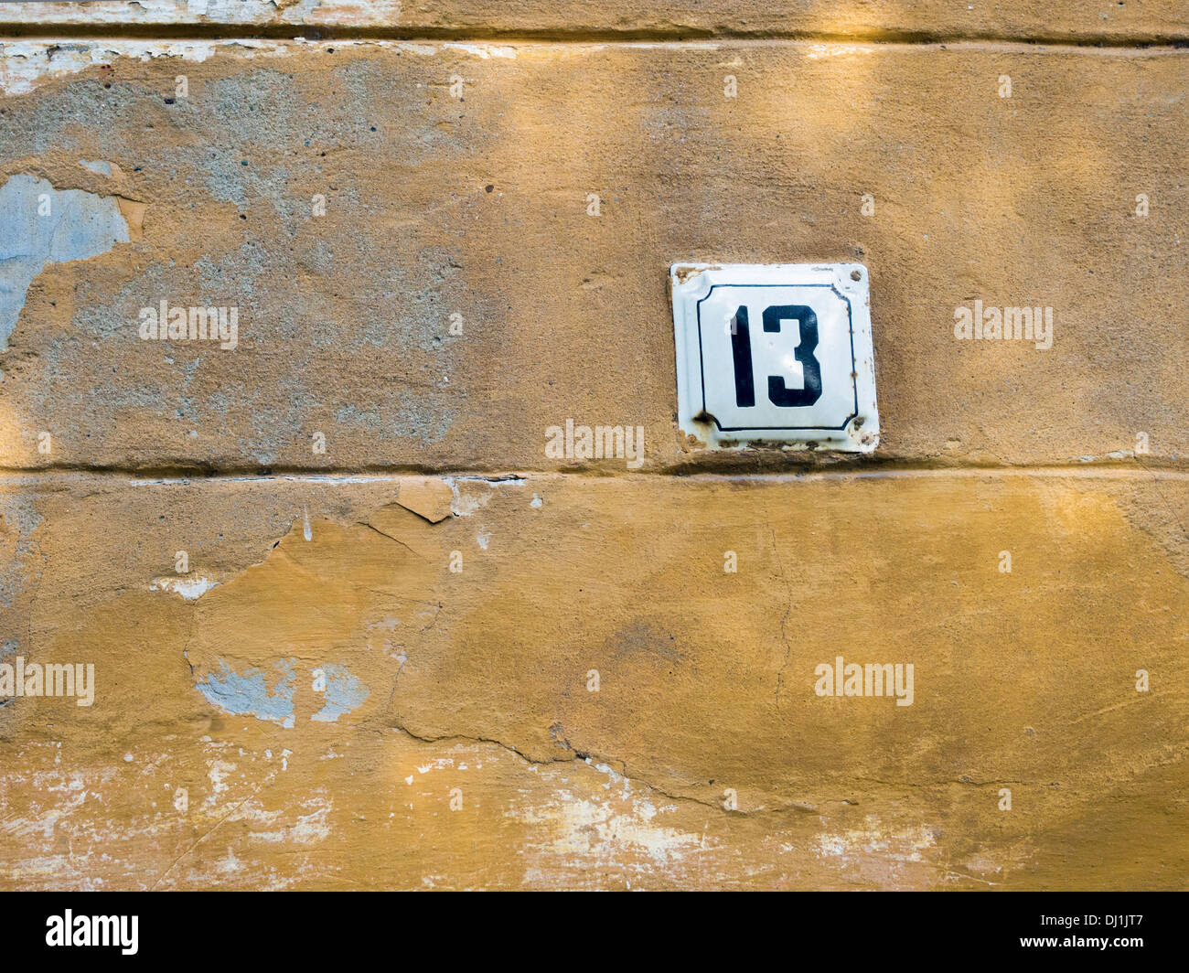 grunge building wall with number 13 plate Stock Photo - Alamy