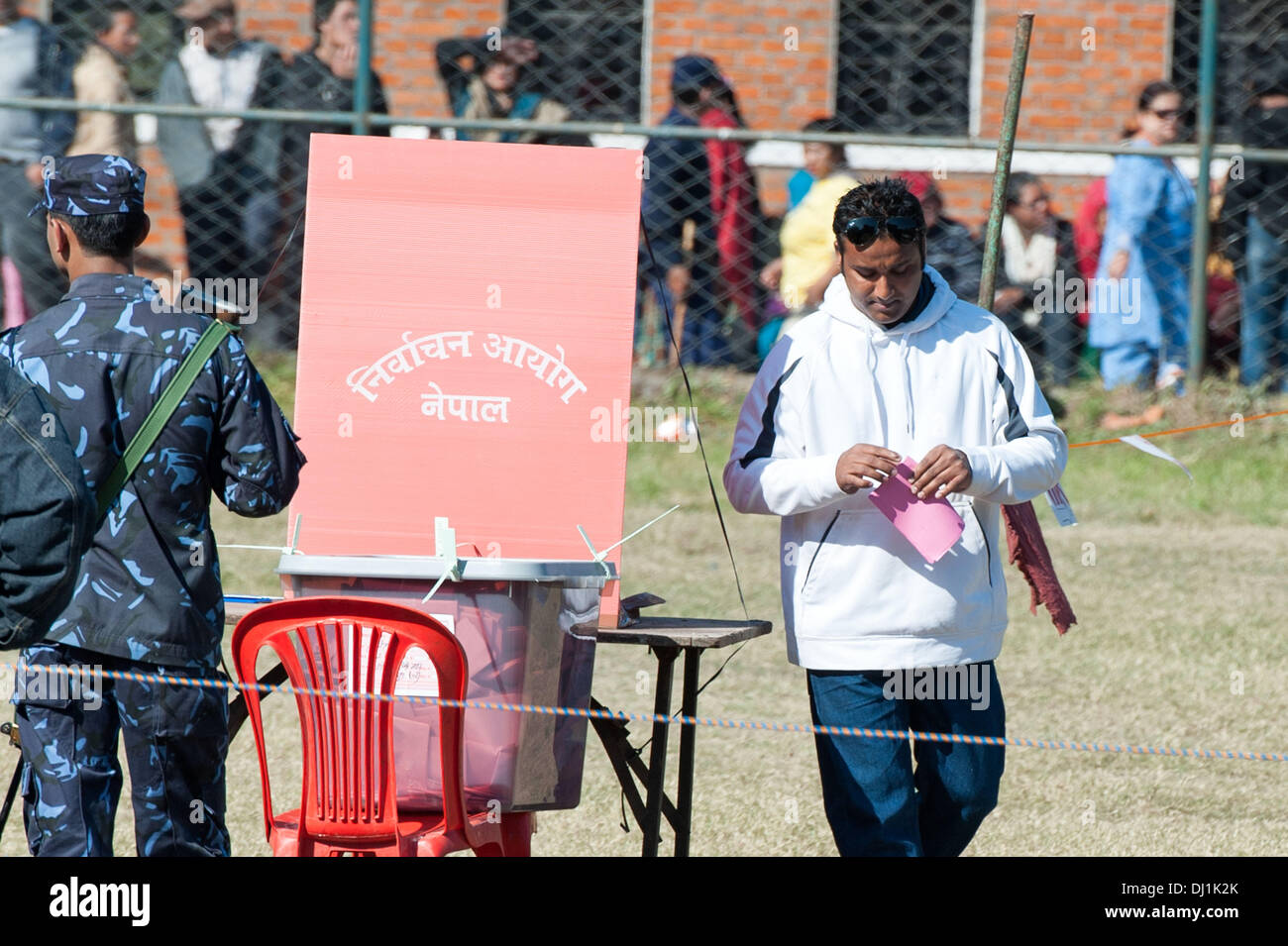 Kathmandu, Kathmandu, Nepal. 19th Nov, 2013. A man folds his ballot ...