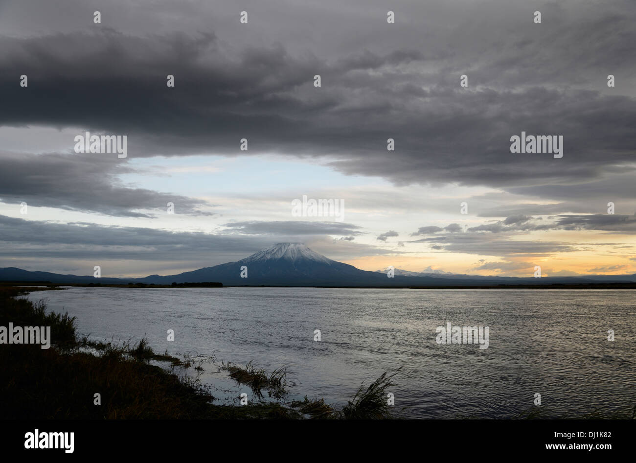Lower Kronotskaya River with Kronotsky Volcano at sunset. Kamchatka ...