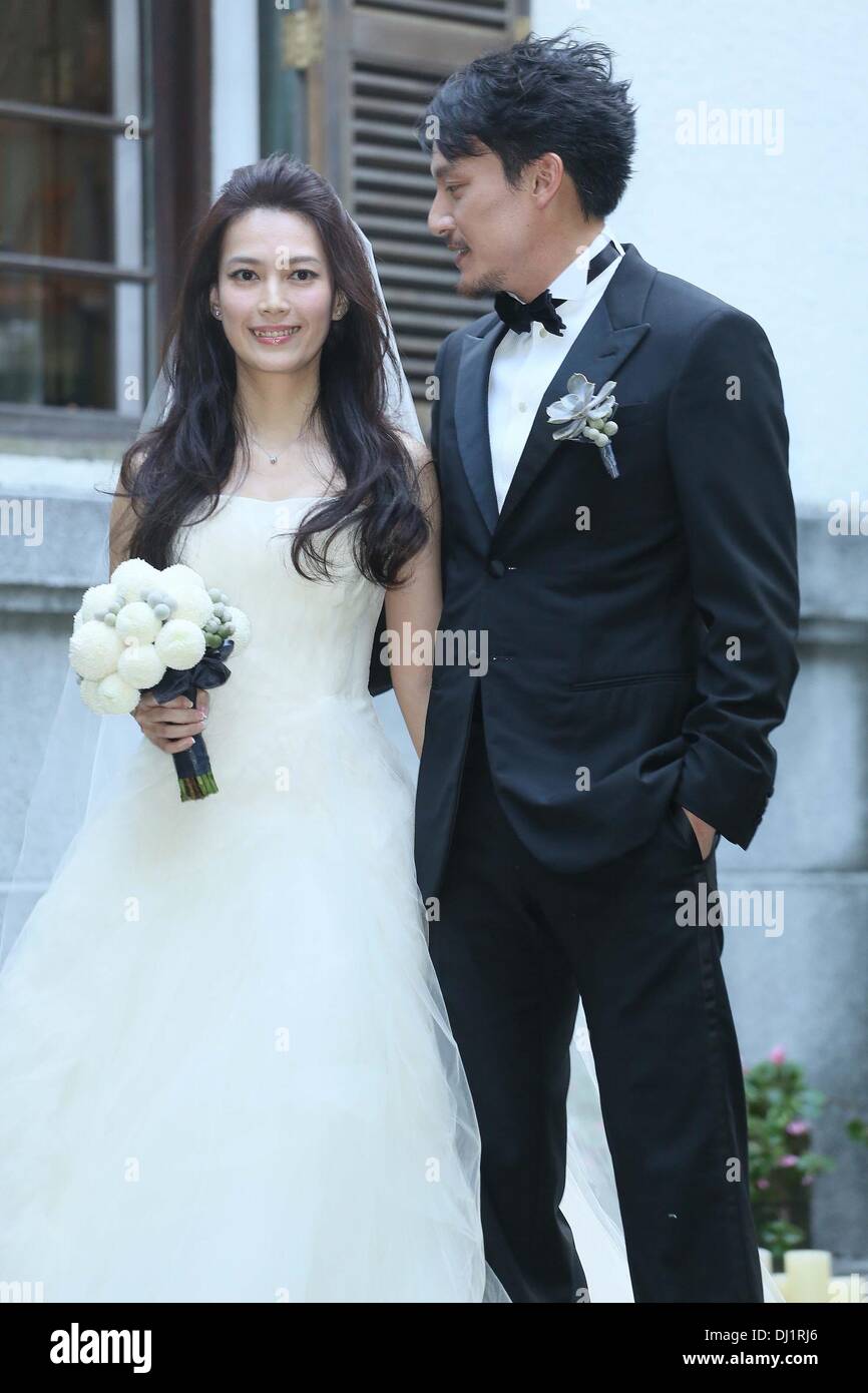 Taipei, China. 18th Nov, 2013. Chang Chen and his wife pose for camera ...