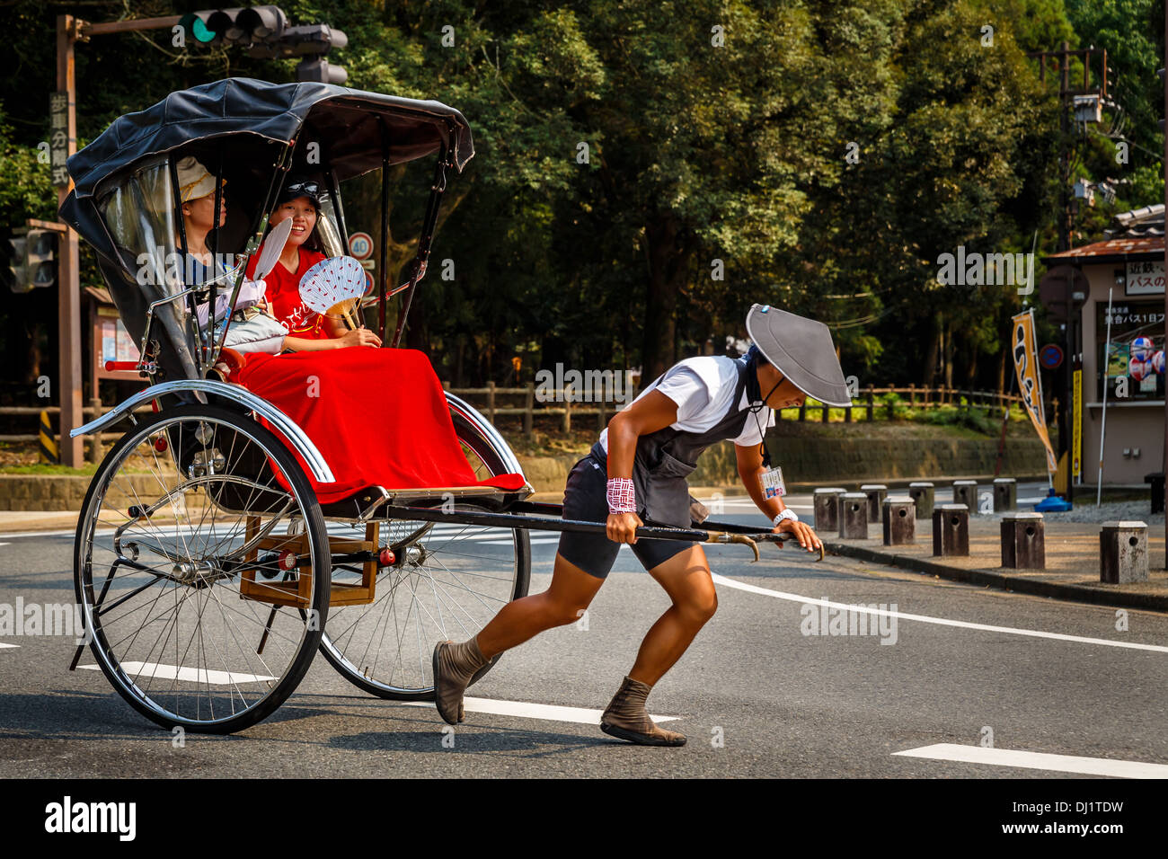 A pulled rickshaw with a passengers, Arashiyama, Kyoto, Japan Stock ...