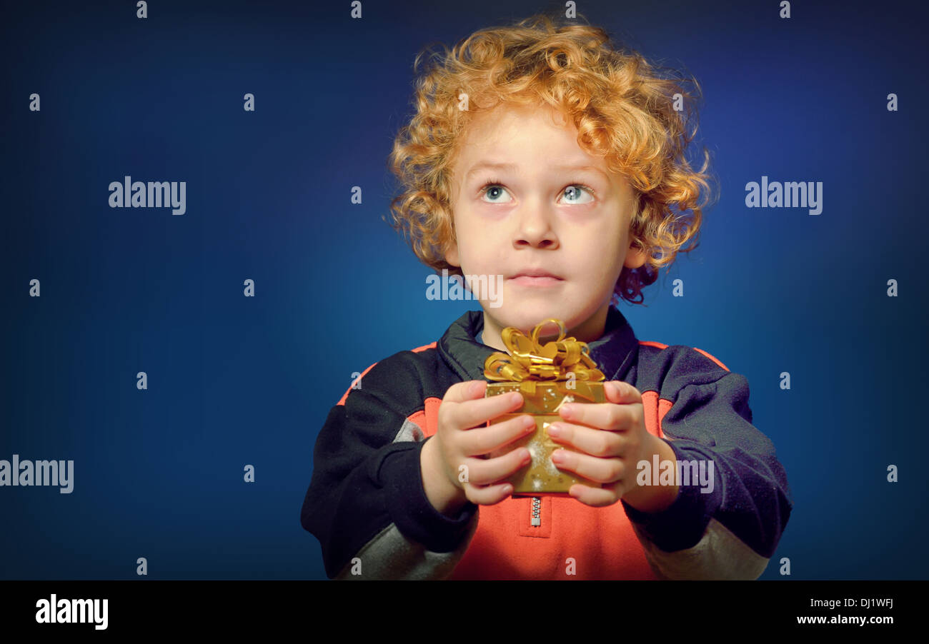 Boy holding a box hi-res stock photography and images - Alamy