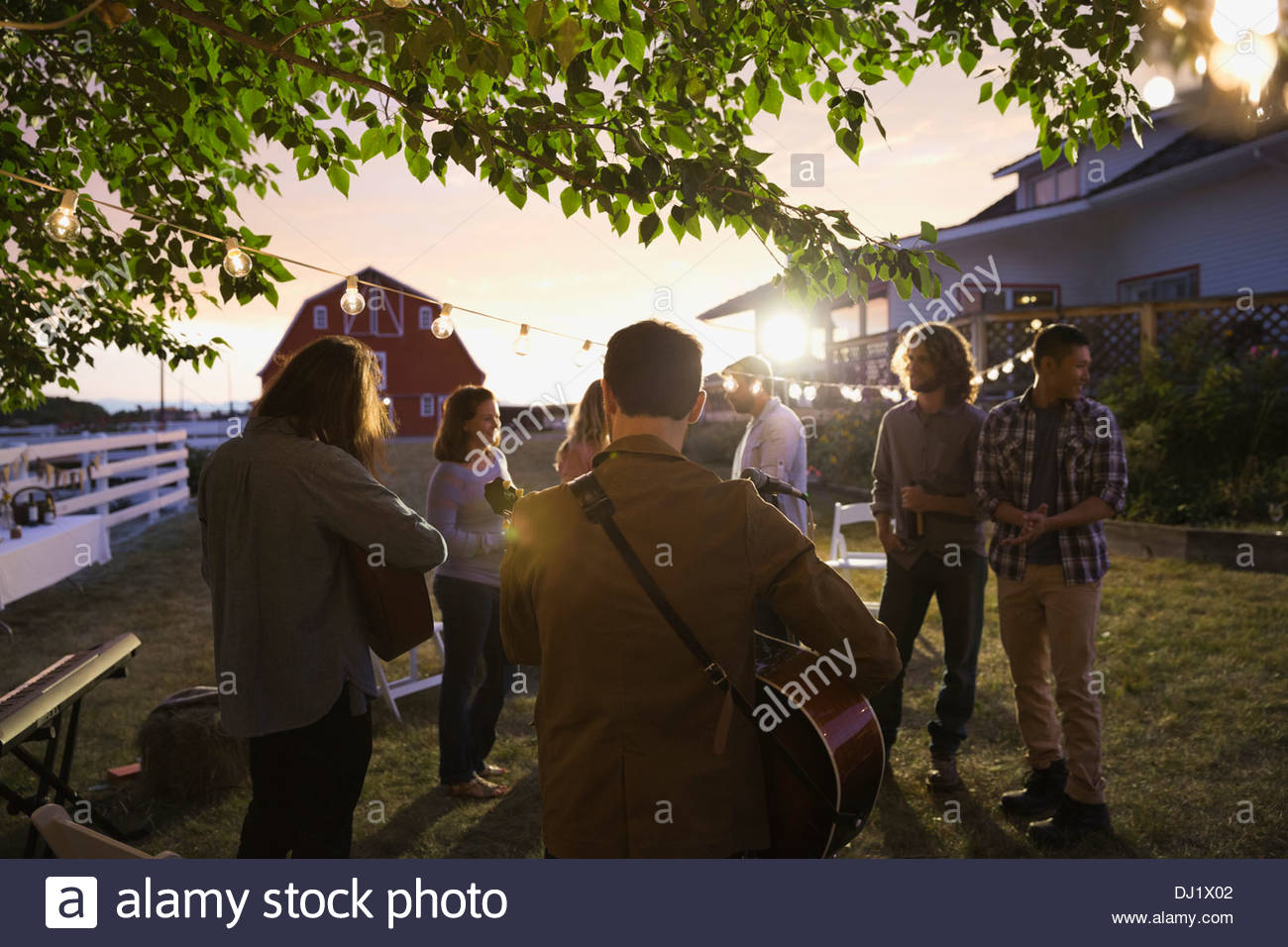 Band playing at outdoor farm party Stock Photo - Alamy