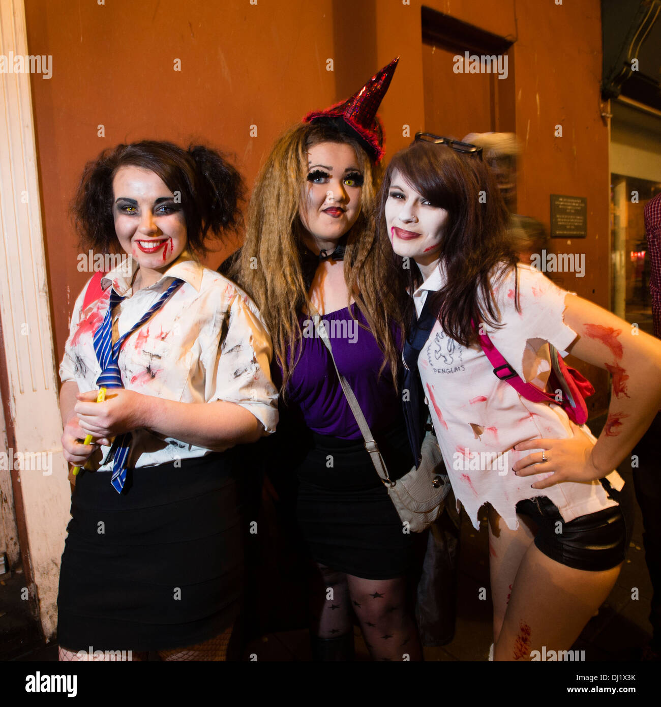 Three Young women, university students, in fancy dress schoolgirl ...