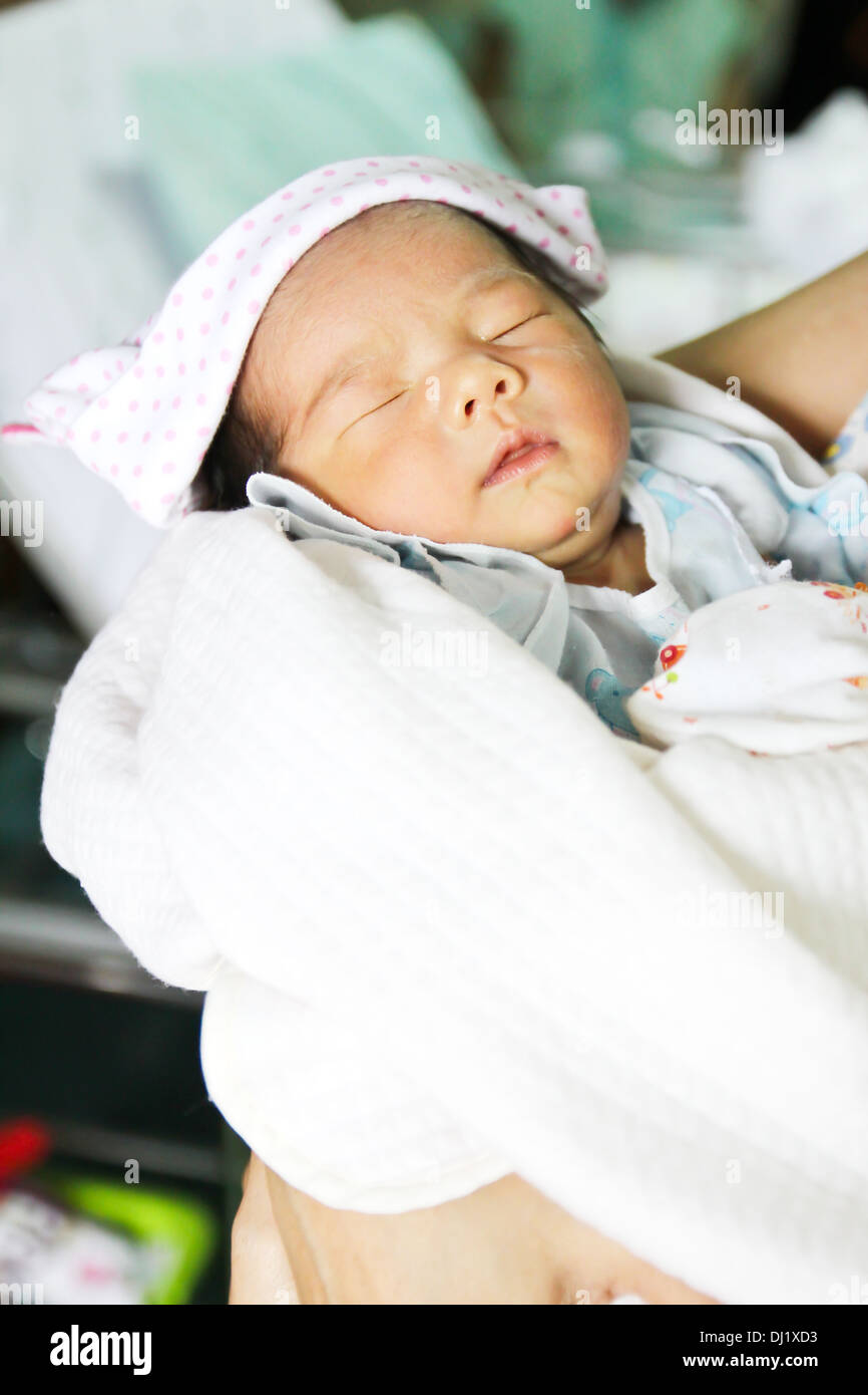Newborn Asian baby girl sleeping Stock Photo - Alamy