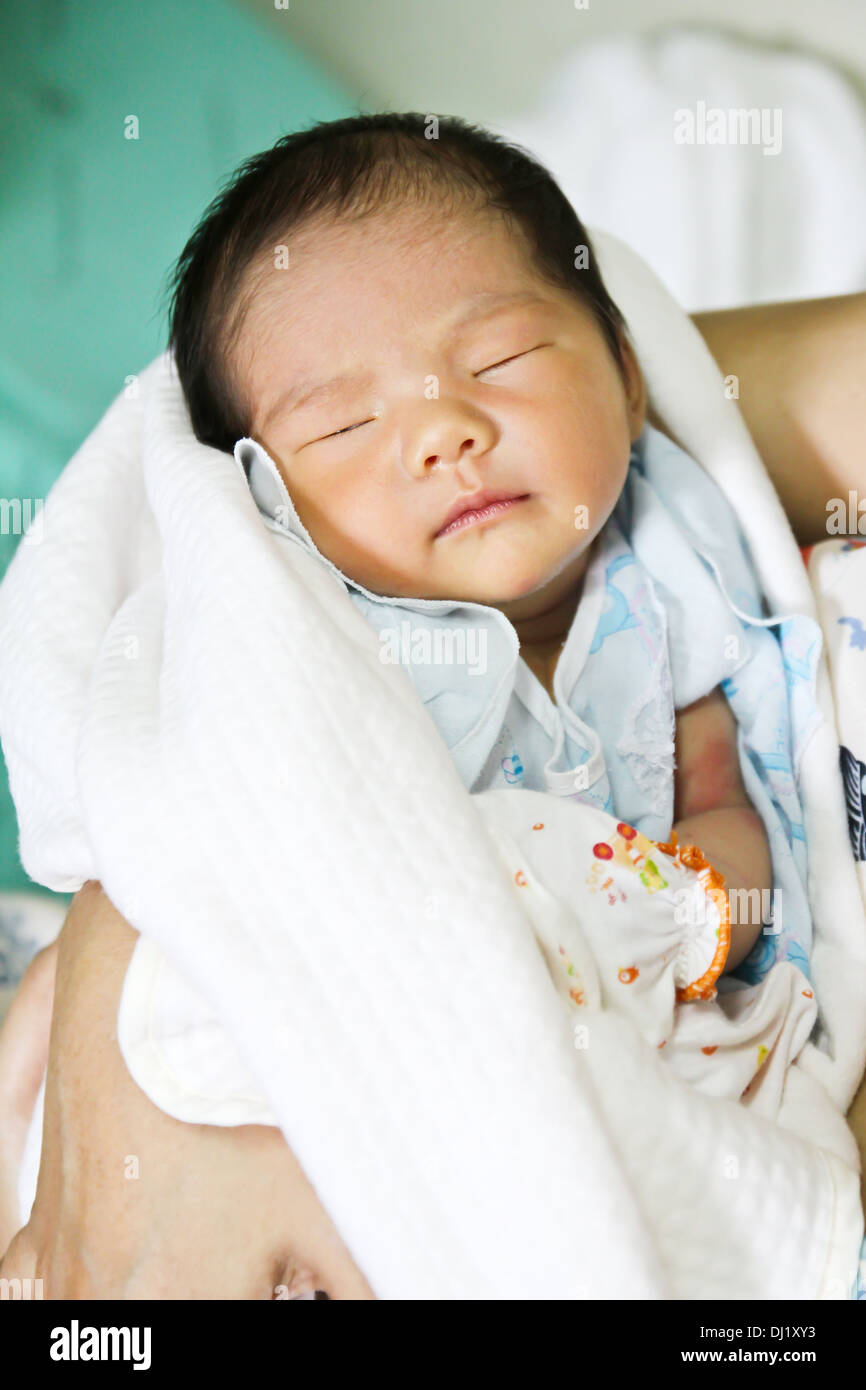 Newborn Asian baby girl sleeping Stock Photo - Alamy