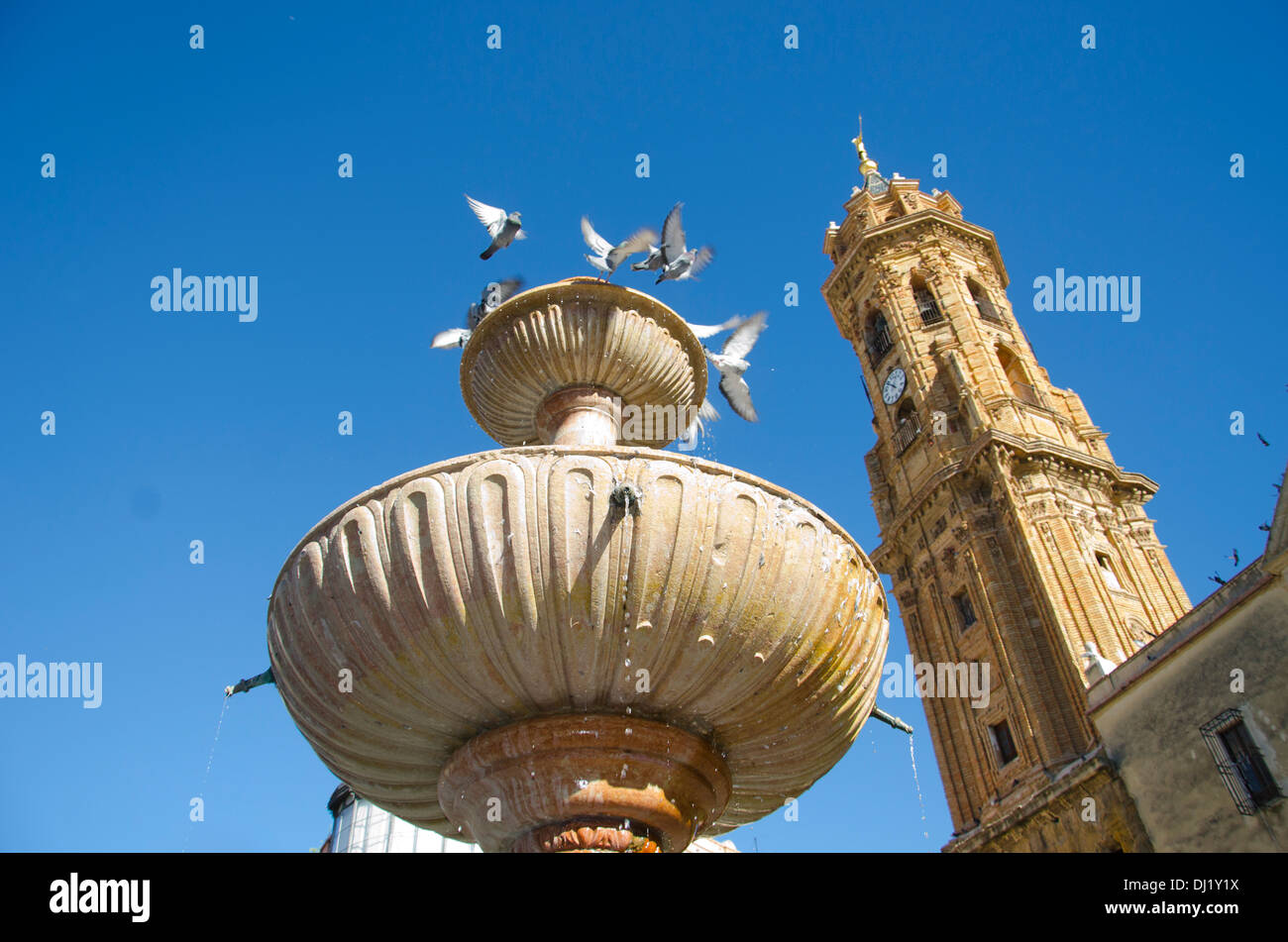 fountain with doves and bell Stock Photo - Alamy