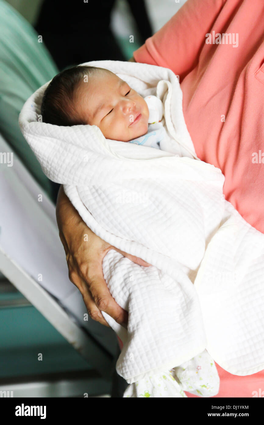 Newborn Asian baby girl sleeping Stock Photo - Alamy