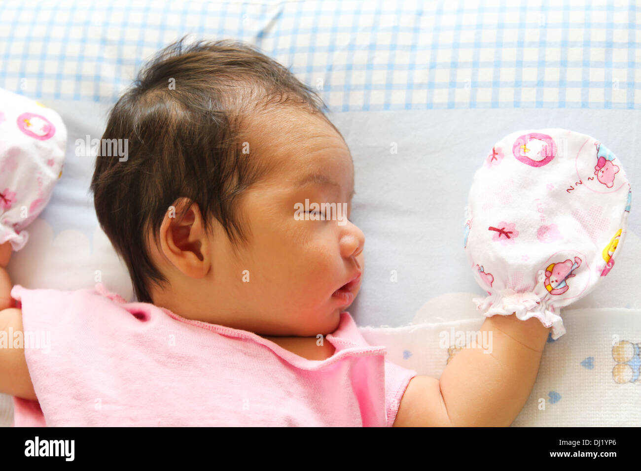 Newborn Asian baby girl sleeping Stock Photo - Alamy