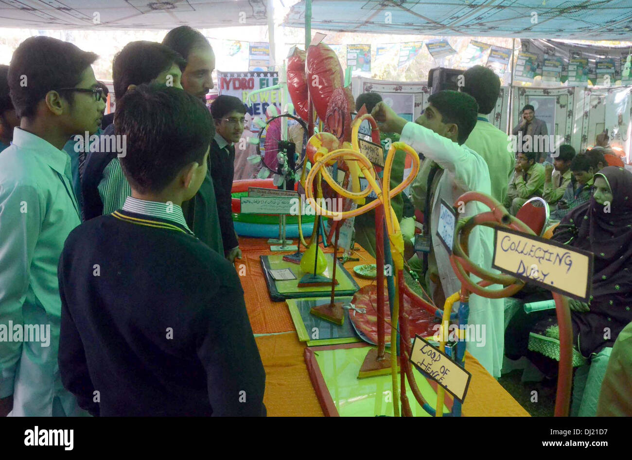 Visitors take keen interest at a stall during Science Exhibition ...