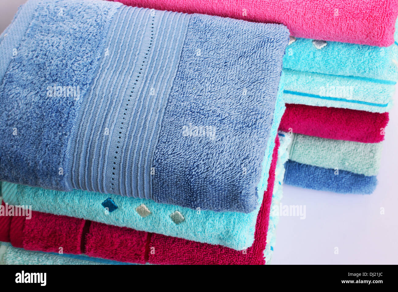 Stack of colorful towels, closeup picture Stock Photo - Alamy