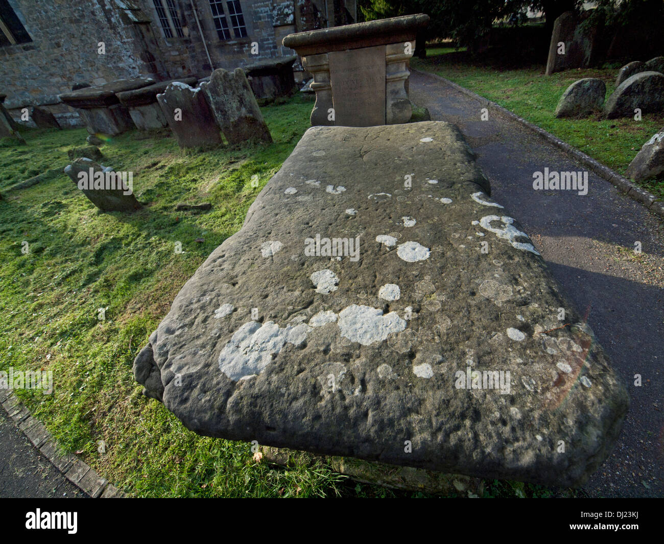 A huge slab of stone upon a tomb in an English churchyard Stock Photo ...
