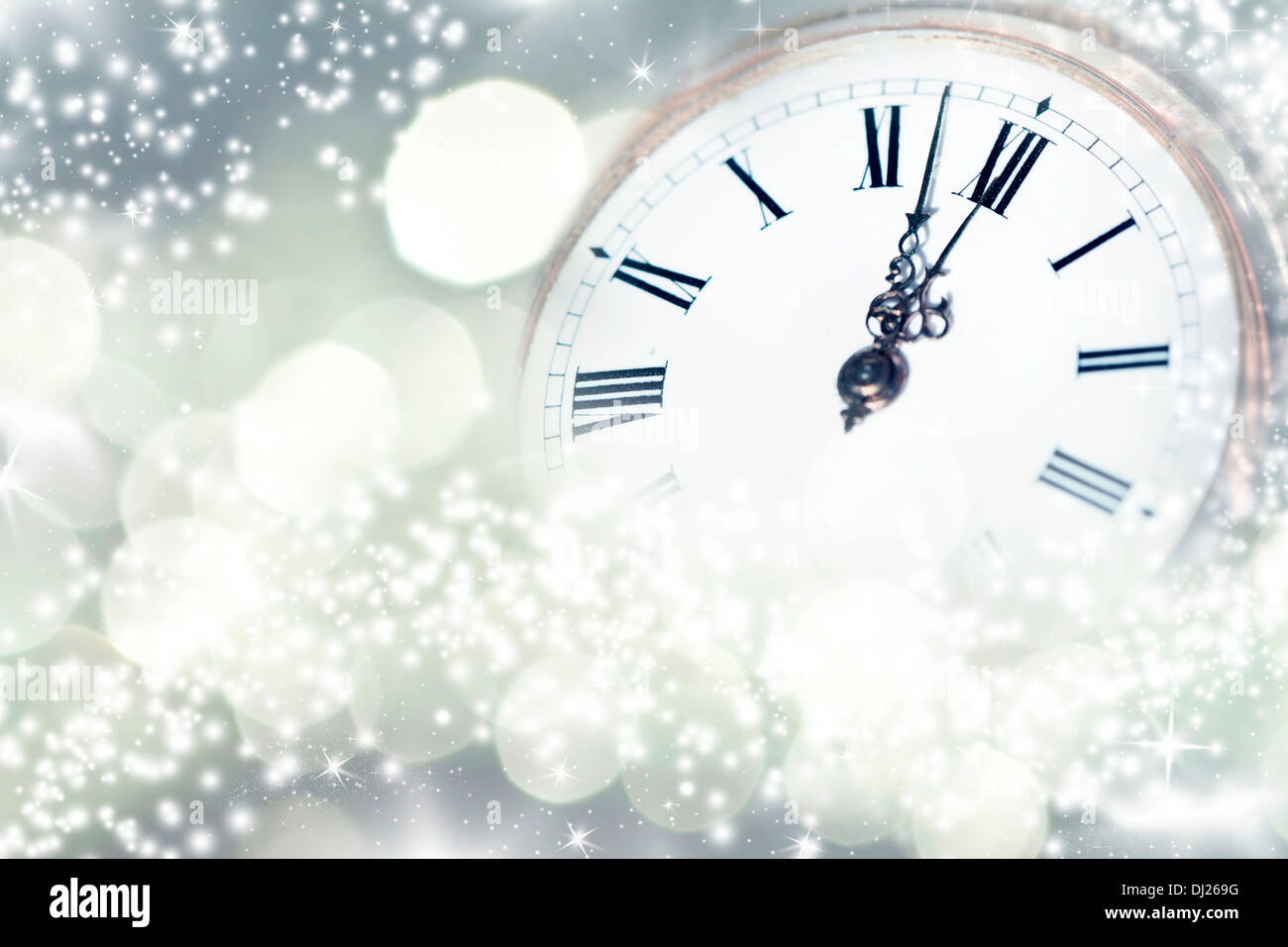 Gold pocket watch pointing midnight Stock Photo - Alamy