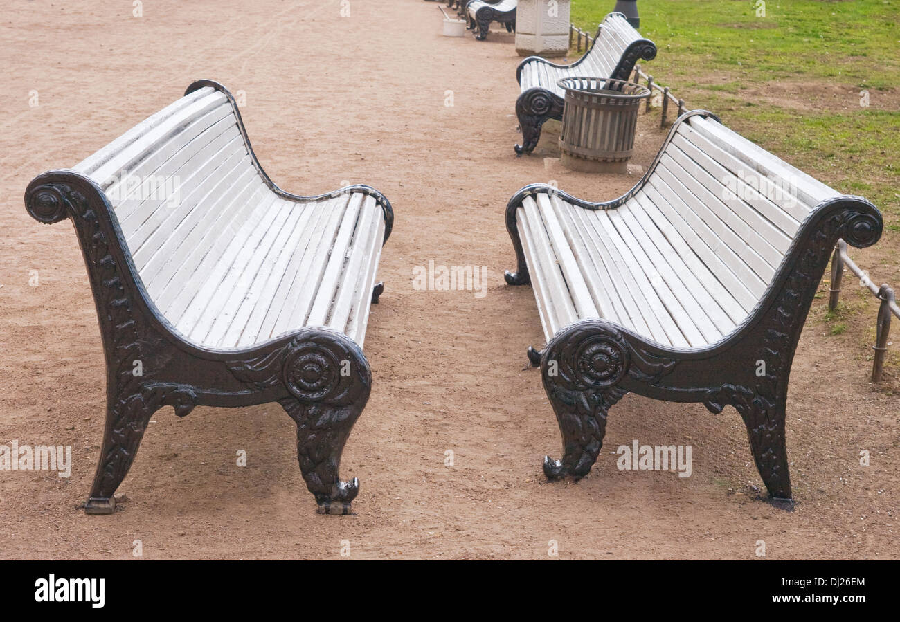 Two park benches standing opposite to each other Stock Photo - Alamy