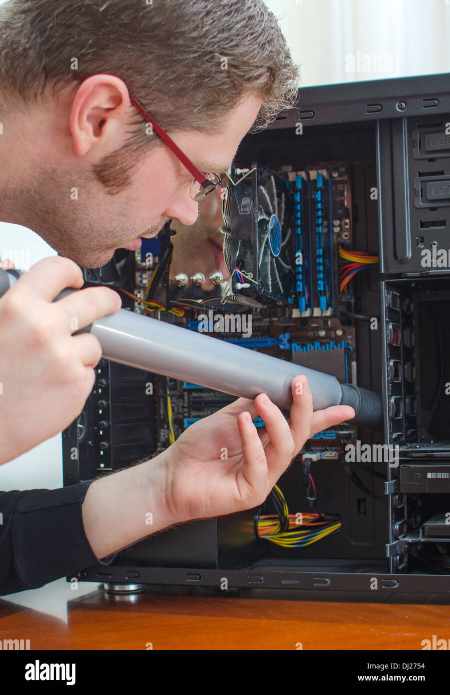 Technician cleaning motherboard man in hi-res stock photography and ...