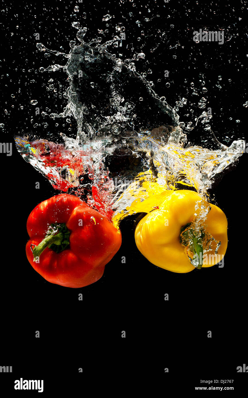 Pepper splashes in water Stock Photo - Alamy
