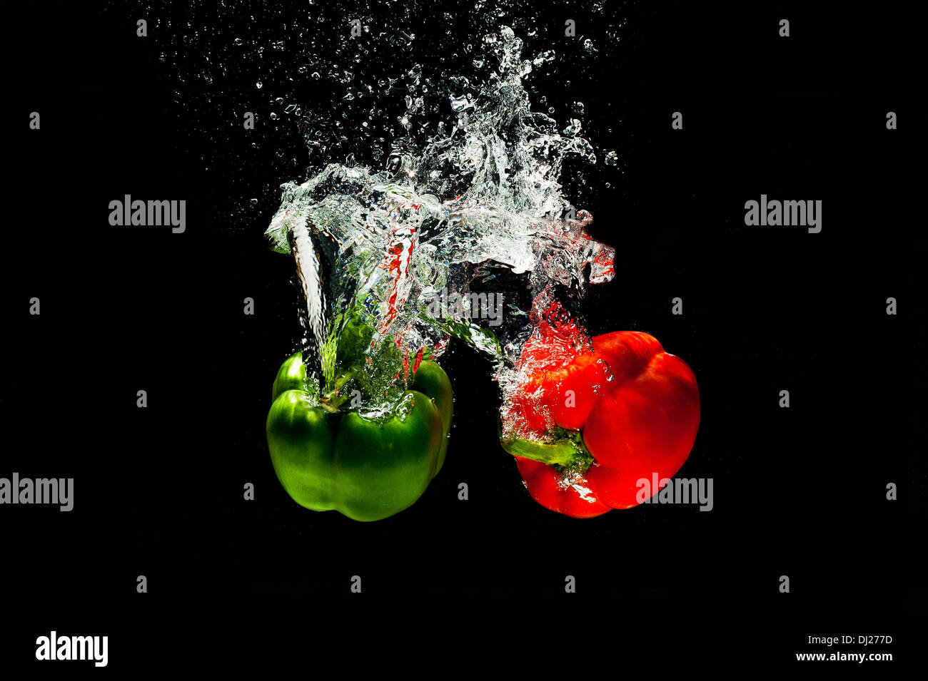 Pepper splashes in water Stock Photo - Alamy