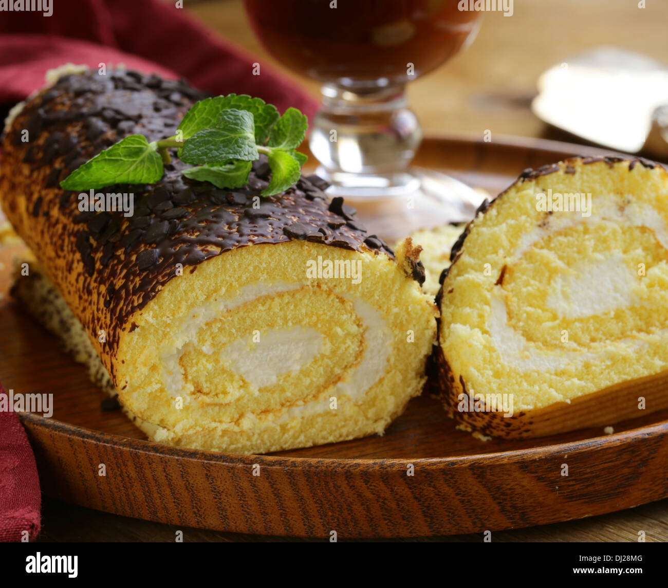vanilla roll cake with chocolate ganache and creamy cream Stock Photo ...