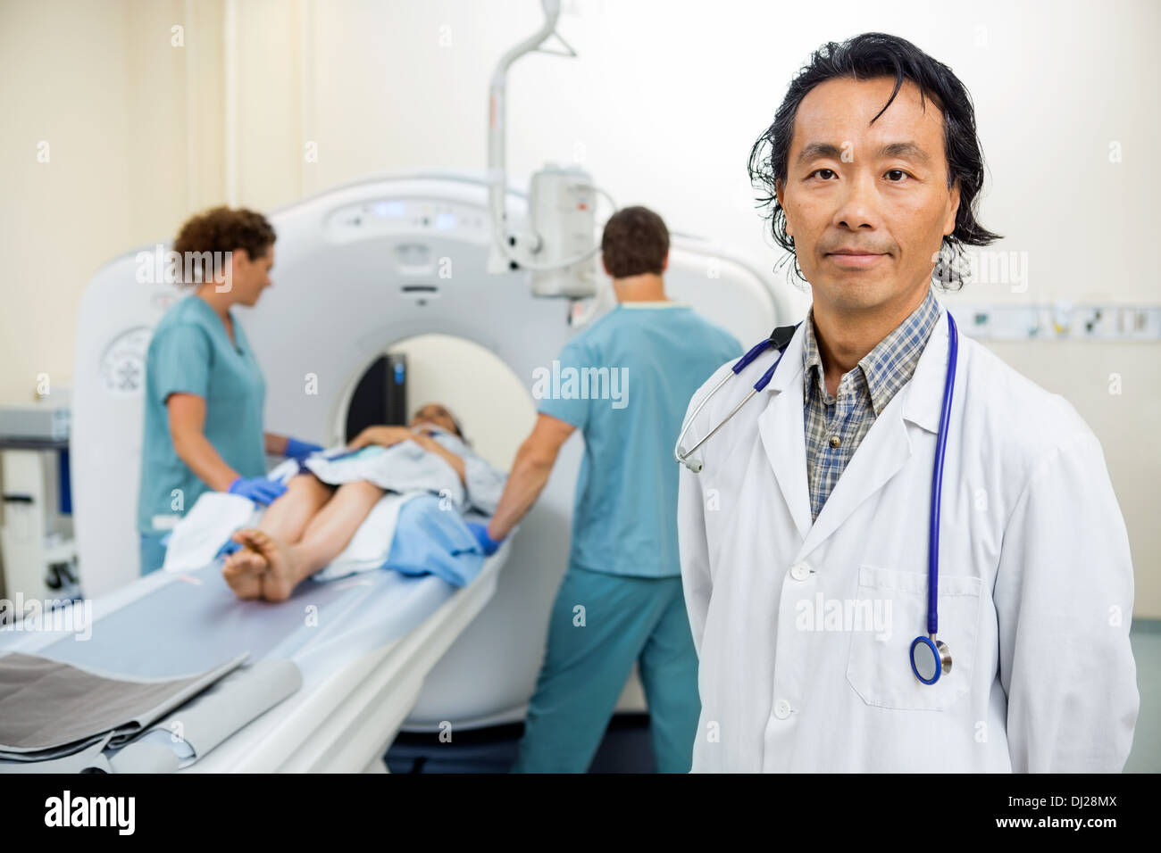Radiologist With Nurses Preparing Patient For CT Scan Test Stock Photo ...