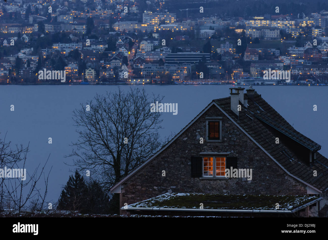 House in a evening winter night by Zurich lake. Switzerland Stock Photo ...