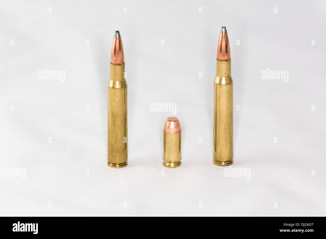 A few rifle and hand gun bullets on white background with details Stock ...