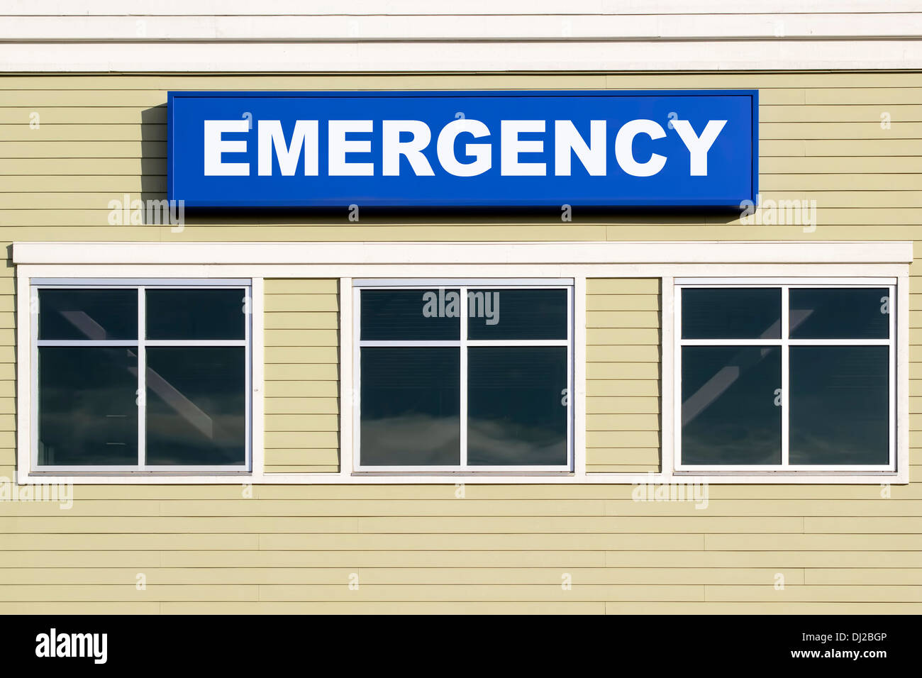 Emergency Sign Above Windows Outside Hospital or Emergency Clinic ...