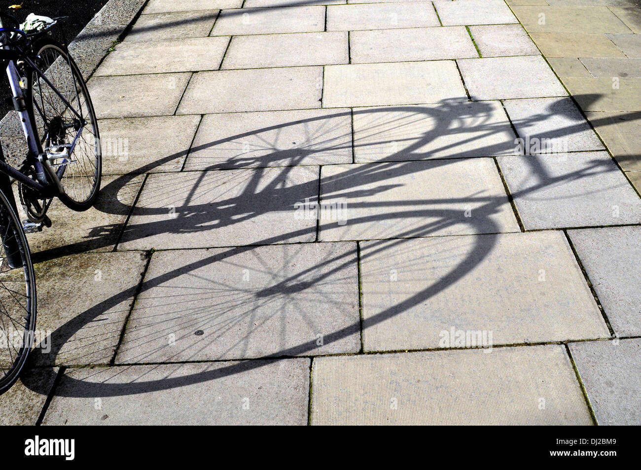 A bicycle and its shadow Stock Photo - Alamy