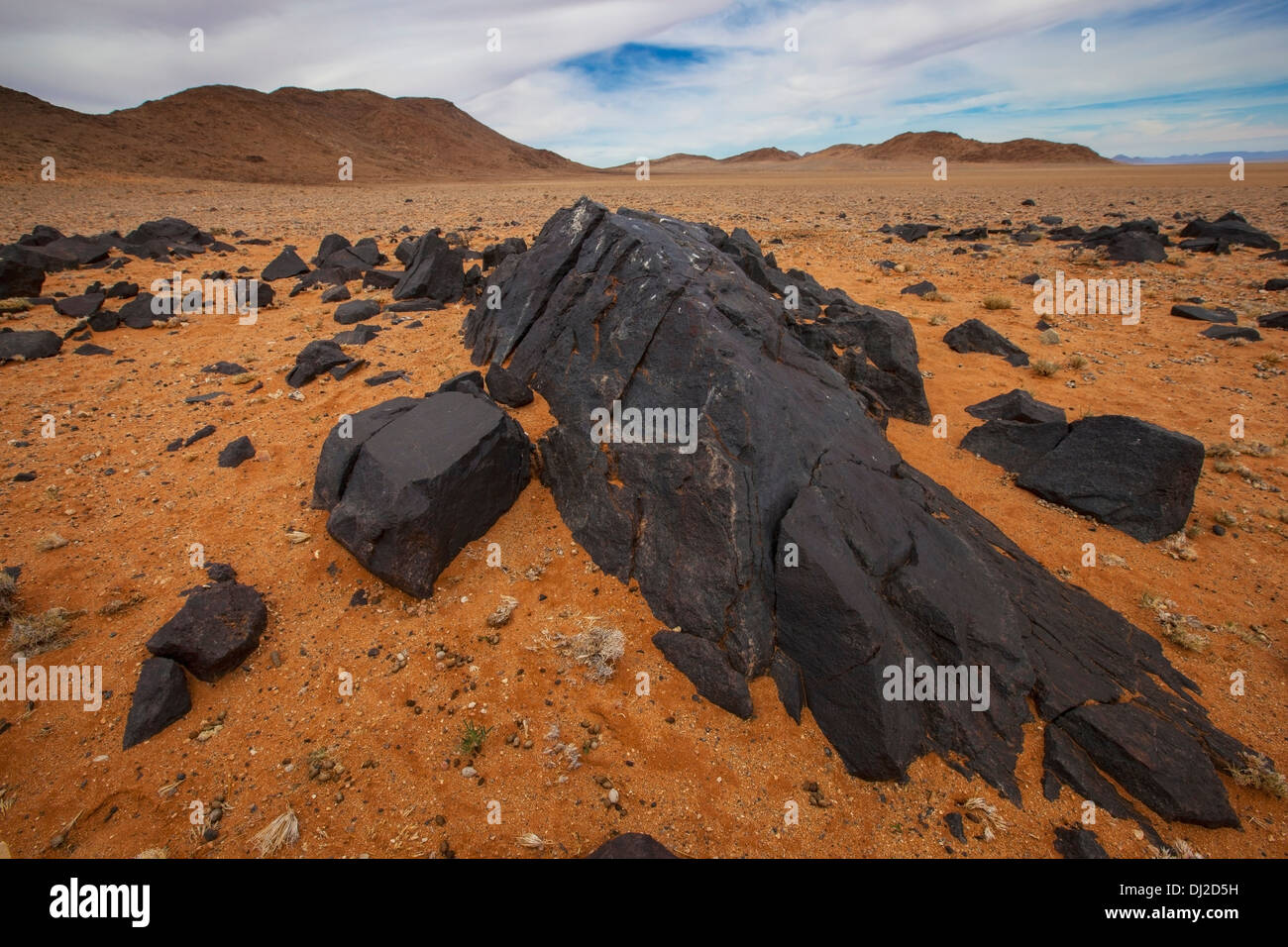 Pitch Black Rocks In The Desert; Klein-Aus Vista, Namibia Stock Photo ...